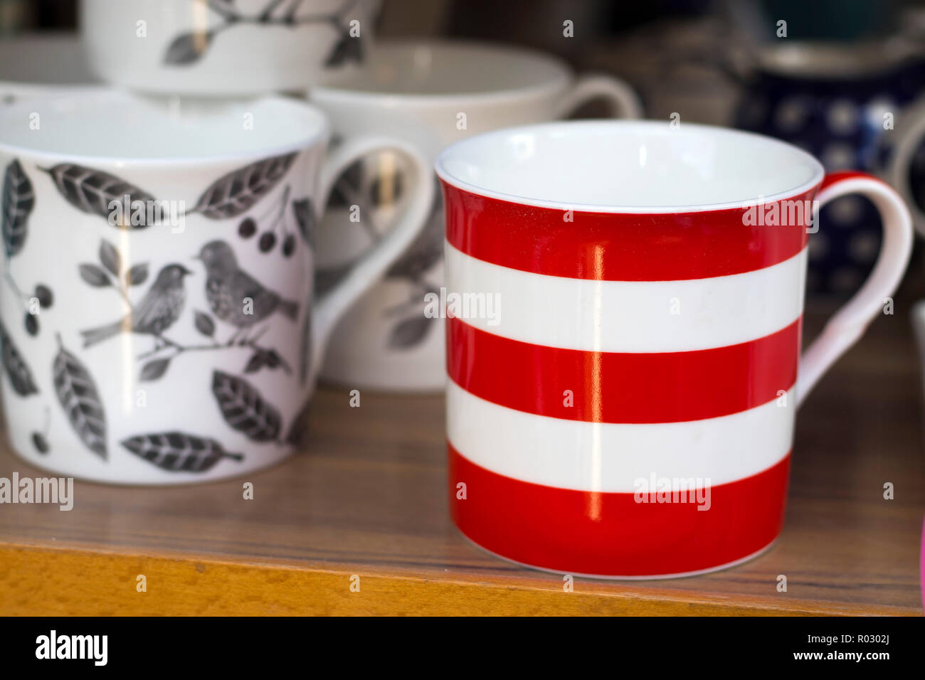 the Red and white striped mug on a shop window Stock Photo - Alamy