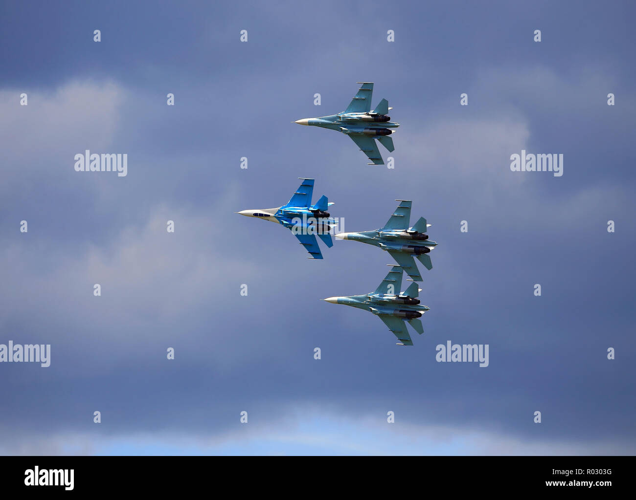 Four fighters perform a turn in the ranks in the sky Stock Photo - Alamy