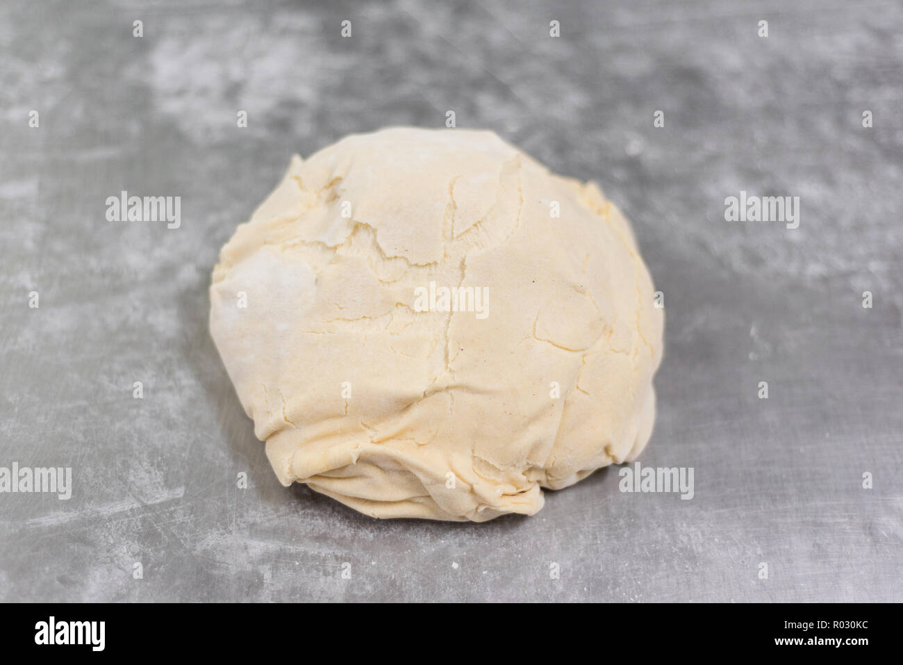 Dough in metal surface. Bakery product Stock Photo - Alamy