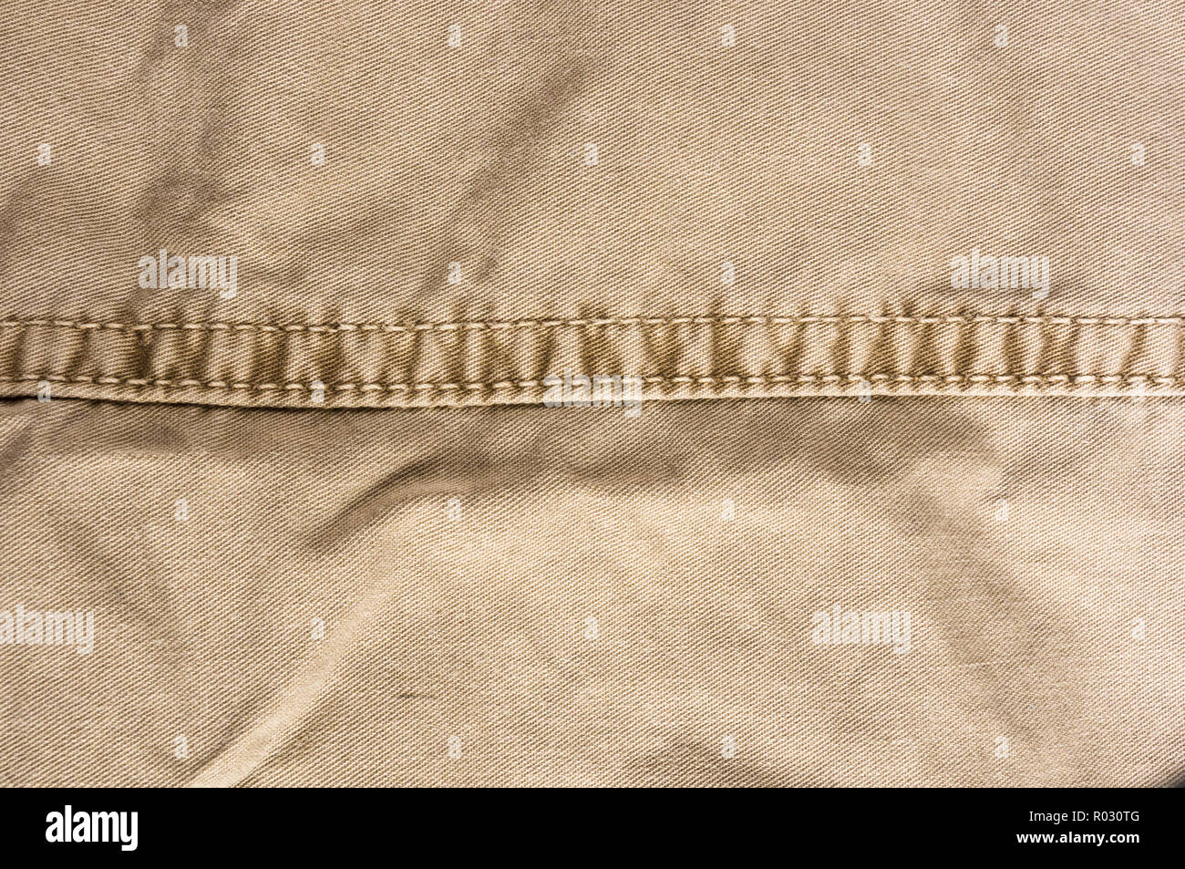 clothing items washed cotton fabric texture with seams, macro, close-up ...
