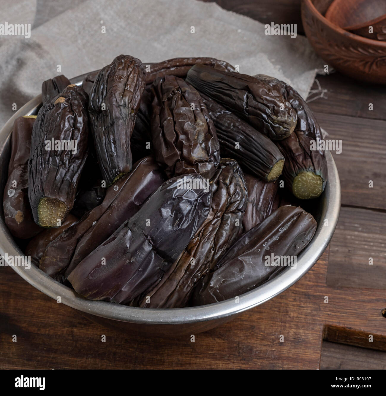 fresh boiled eggplants in an iron bowl, top view Stock Photo - Alamy