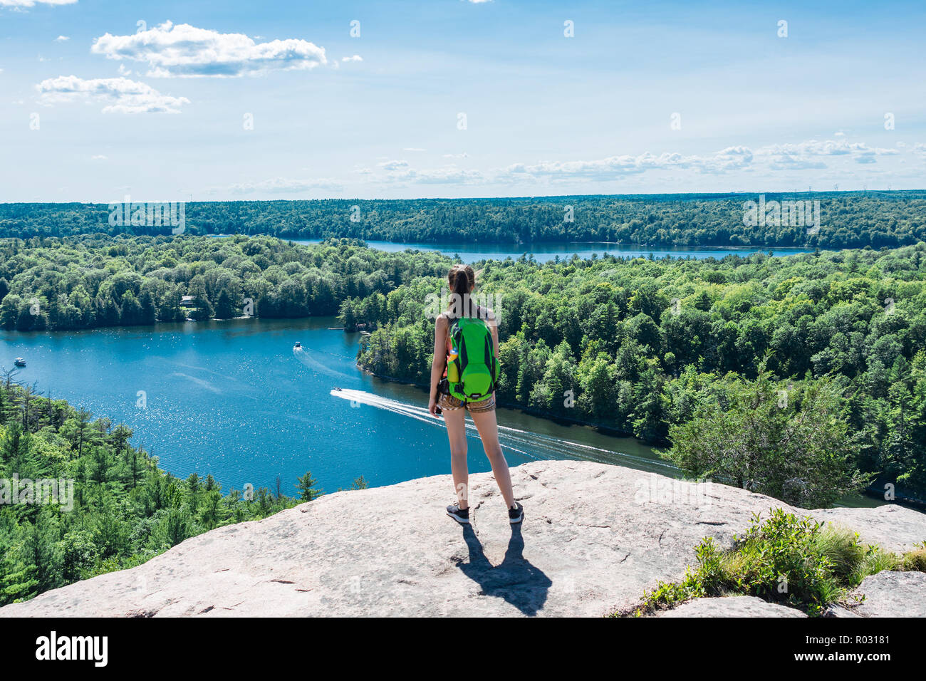 Girl standing on mountain top hi-res stock photography and images - Alamy