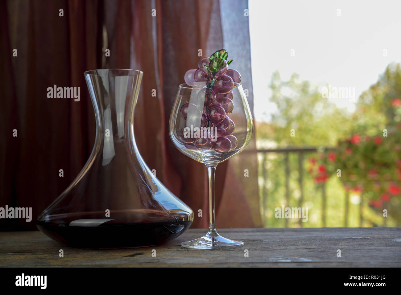 Italian red wine inside the decanter and goblet with decorations ...