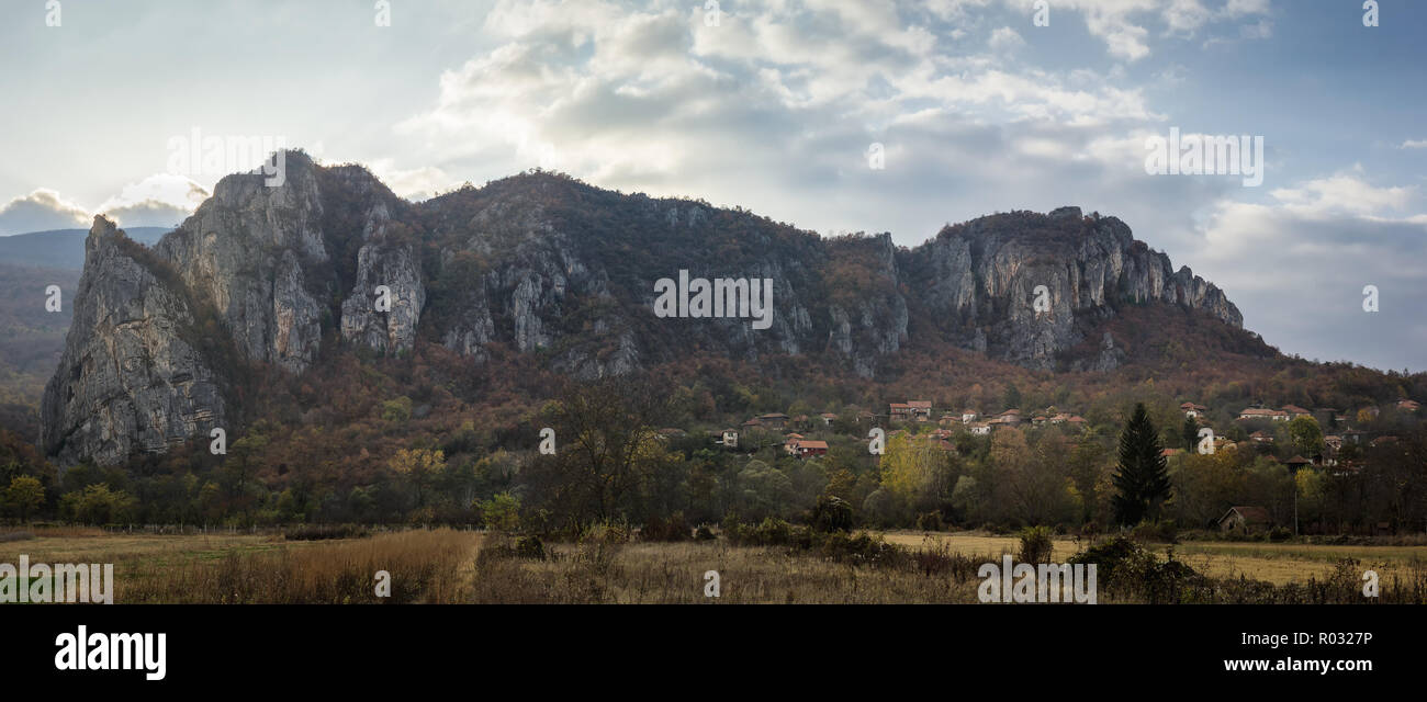 Large panorama of iconic village Vlasi at the base of a rocky mountain ...