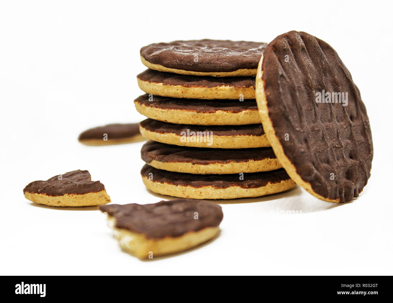 Stack of whole wheat diet biscuits. Dark chocolate covered cookies on ...