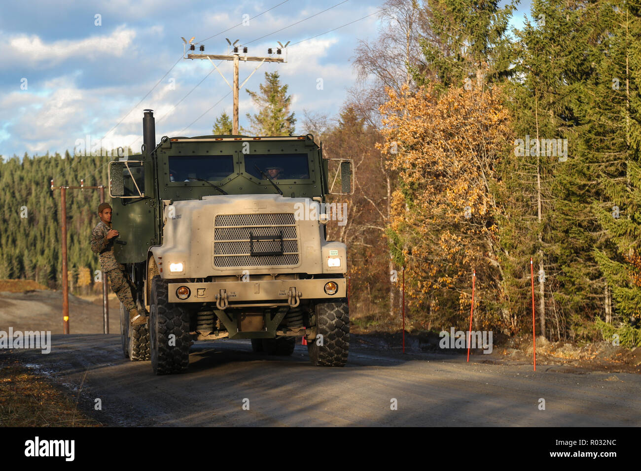 U.S. Marines with Combat Logistics Battalion 2 transport equipment on a ...