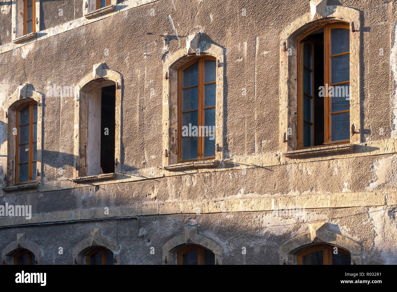 Typical old French building facade with arched windows Stock Photo - Alamy