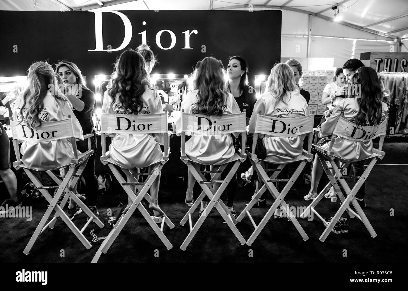 MIAMI BEACH, FL - July 13, 2018: A model prepares backstage for the ...