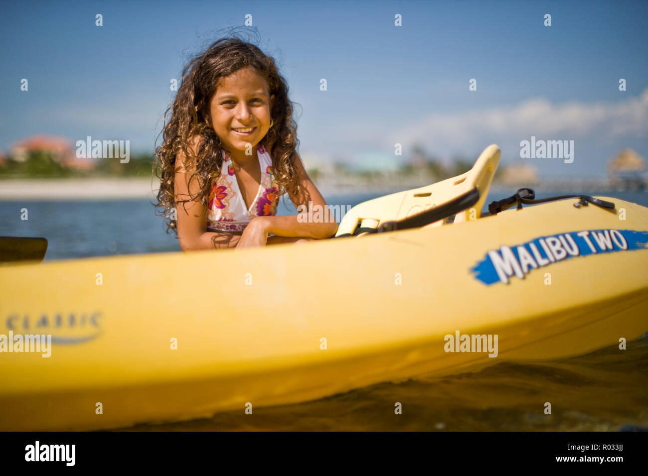 Portrait of a young girl sitting in a kayak on the sea Stock Photo - Alamy
