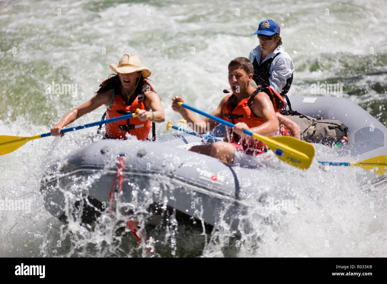 Group of people white water rafting in a river Stock Photo - Alamy