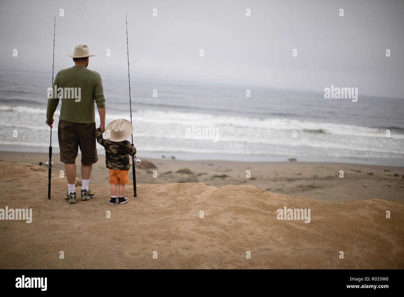 Two hold fishing rods hi-res stock photography and images - Alamy