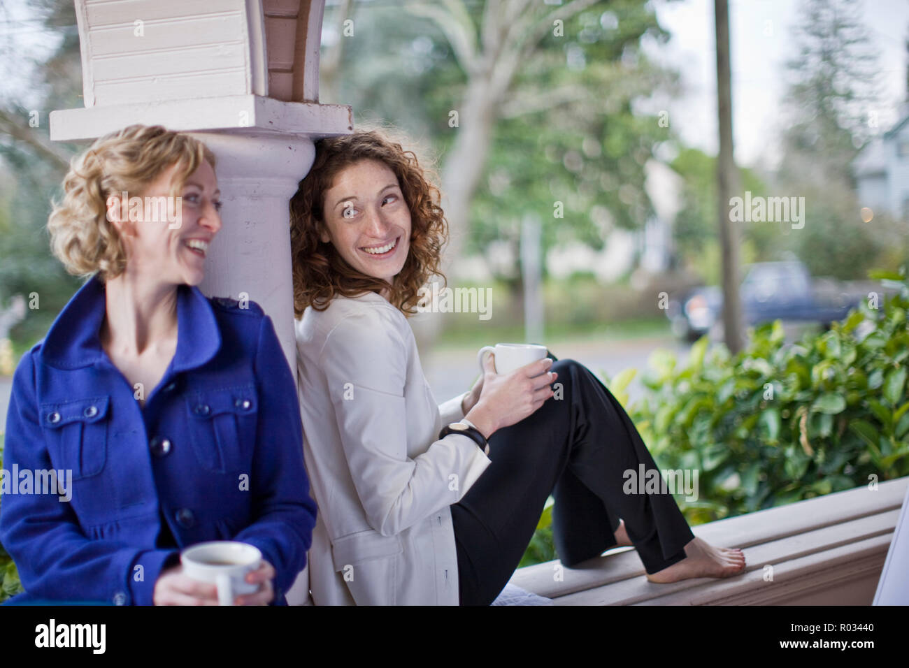 Two women sit on porch hi-res stock photography and images - Alamy