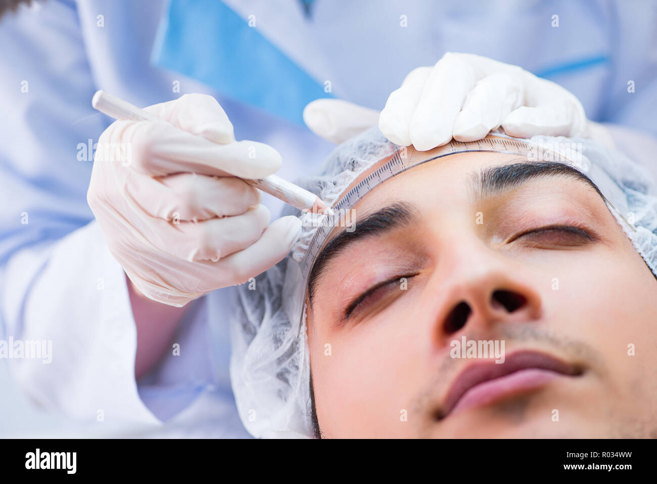 Doctor measuring patient's face before plastic surgery Stock Photo - Alamy