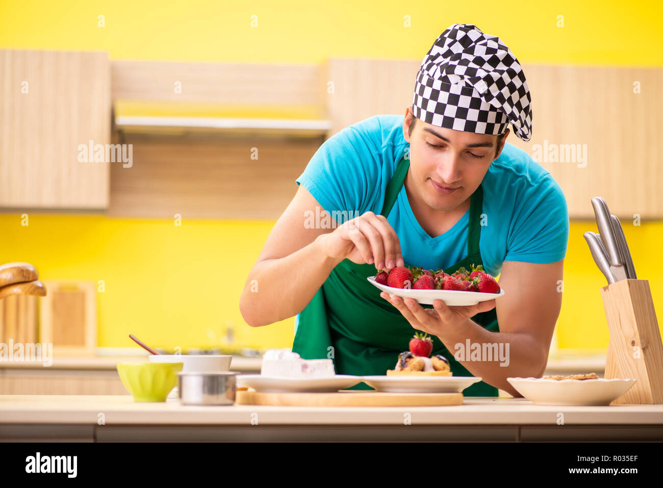 Man cook preparing cake in kitchen at home Stock Photo - Alamy