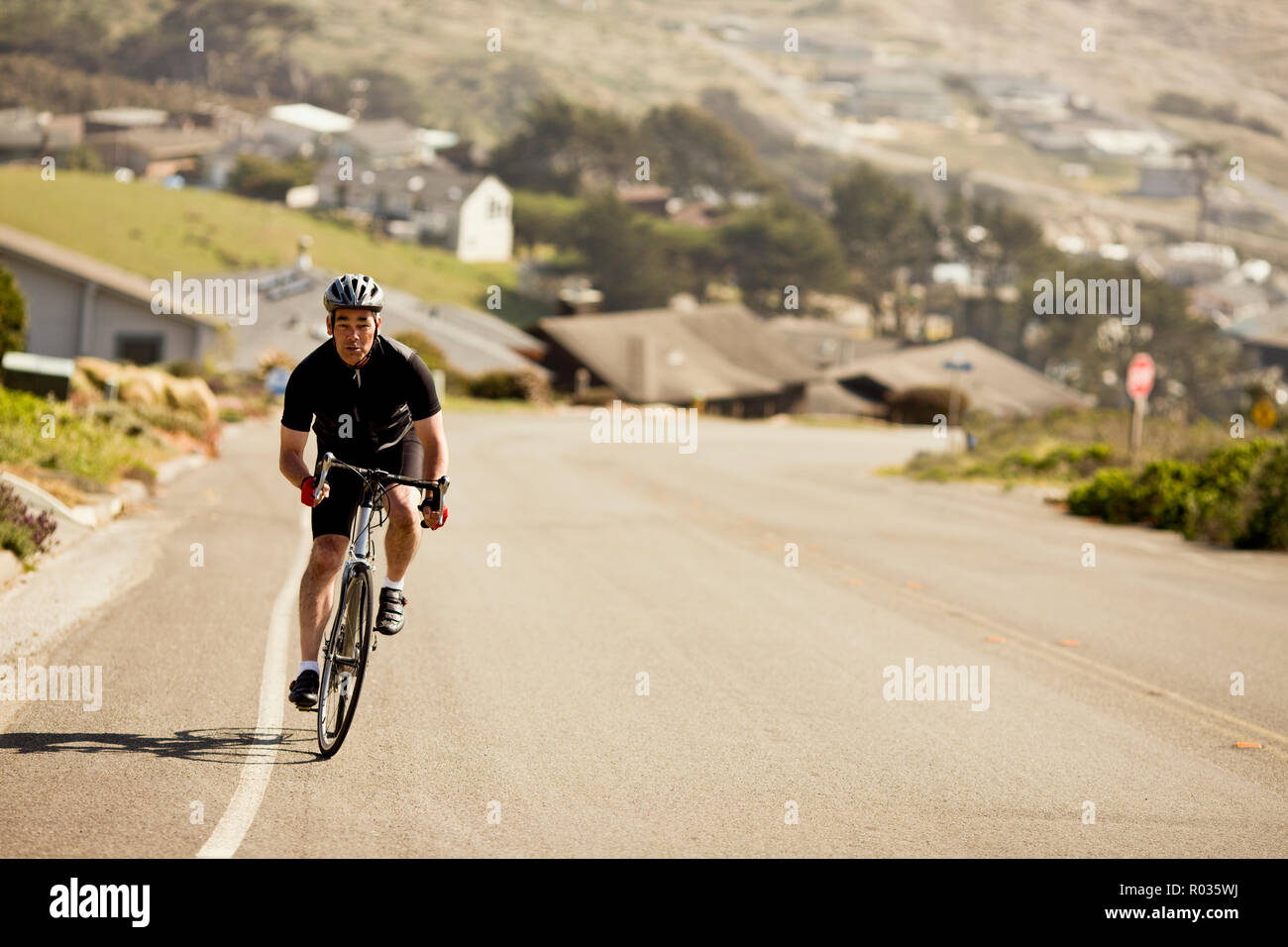 Mature man riding a bike Stock Photo - Alamy