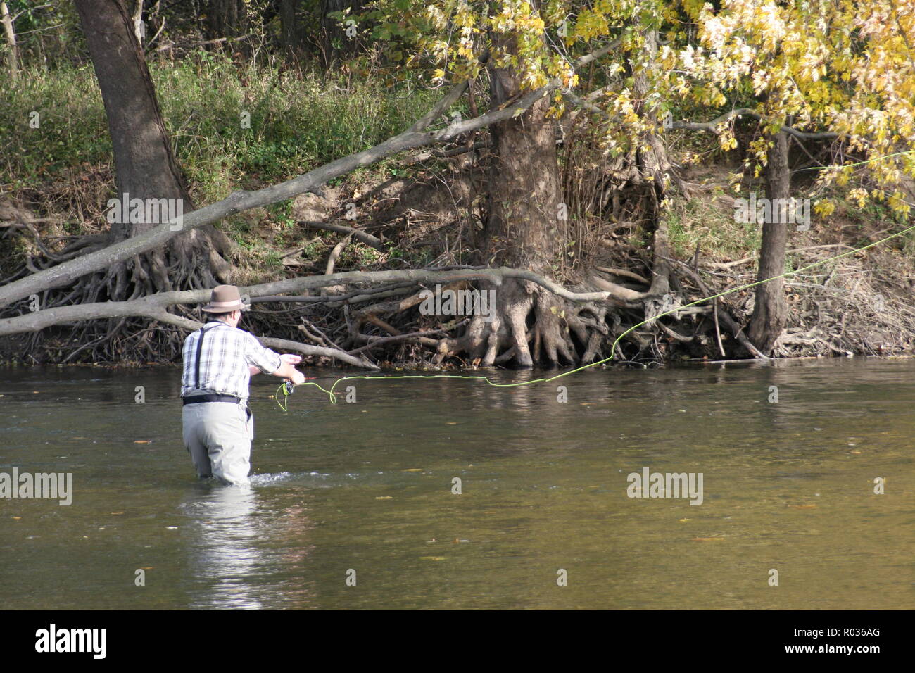 Fly Fishing in a slow moving river Stock Photo - Alamy