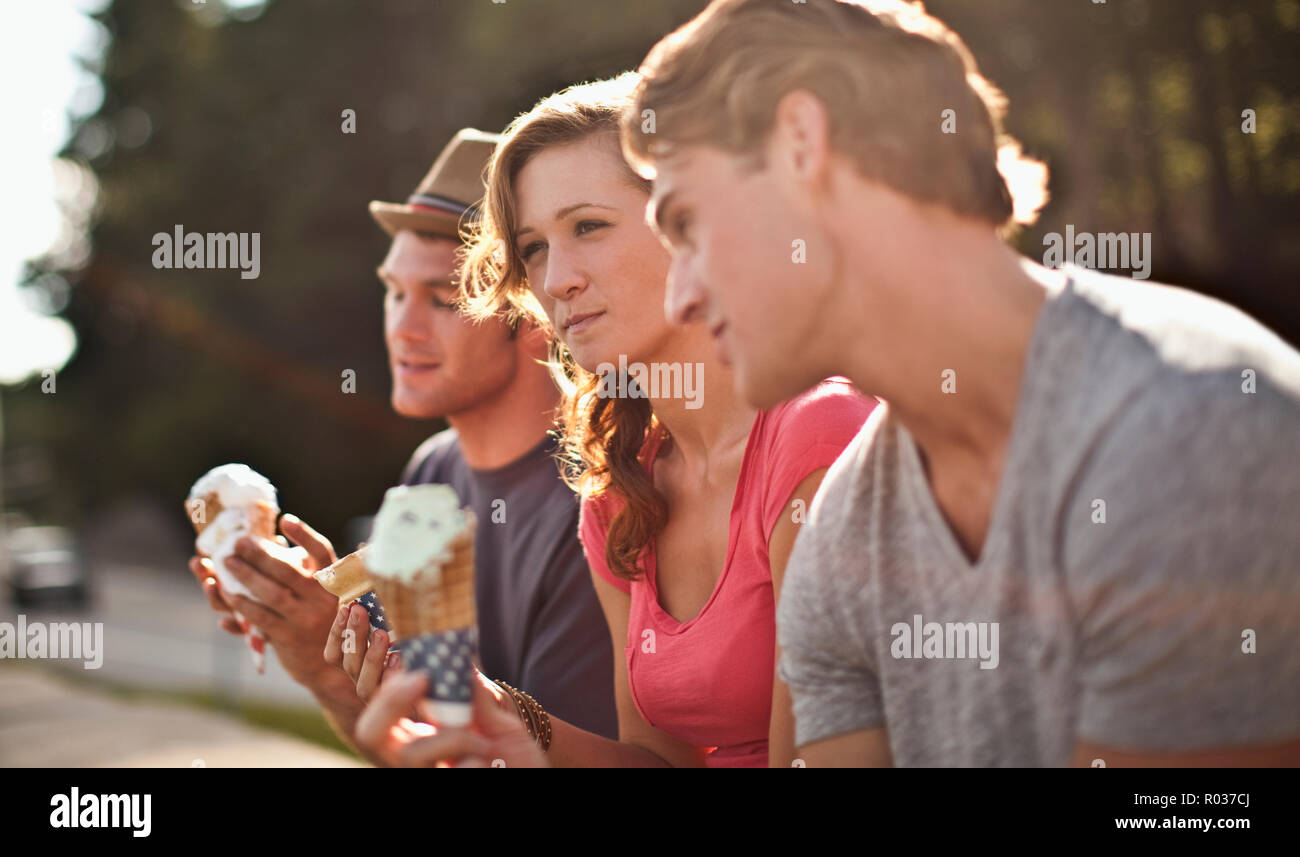 Three friends enjoying ice-cream together Stock Photo - Alamy