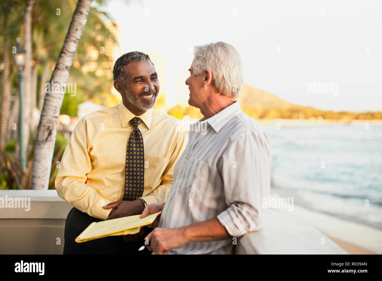 Two business colleagues laughing together Stock Photo - Alamy