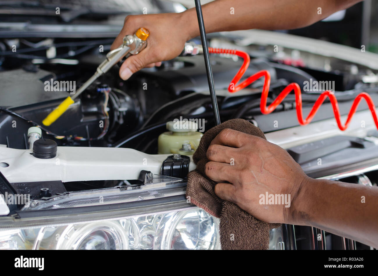 Mans hands checking machine hi-res stock photography and images - Alamy