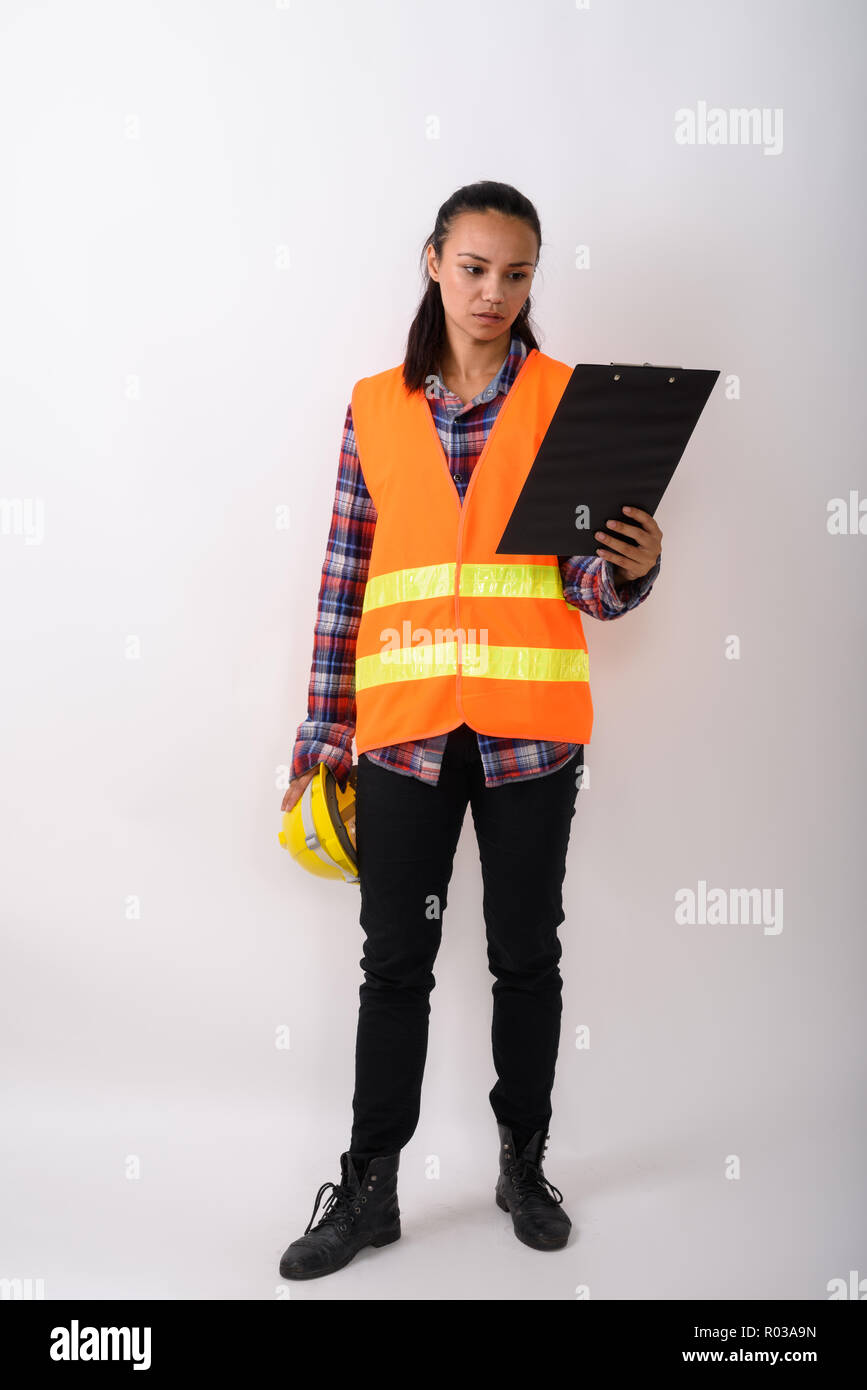 Full body shot of young Asian woman construction worker standing Stock ...