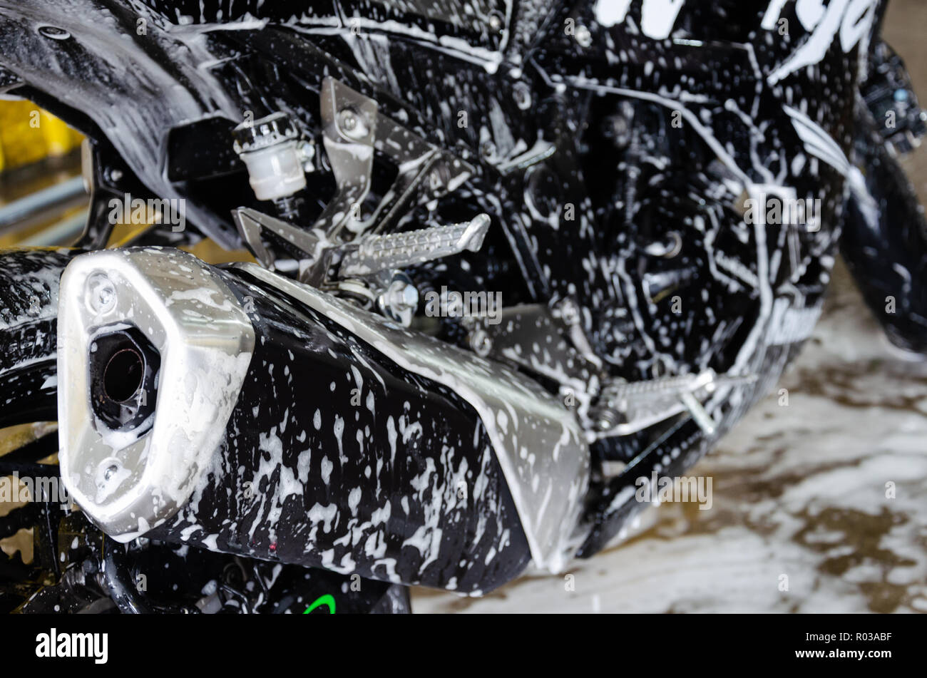 Wash motorcycle with foam Stock Photo - Alamy
