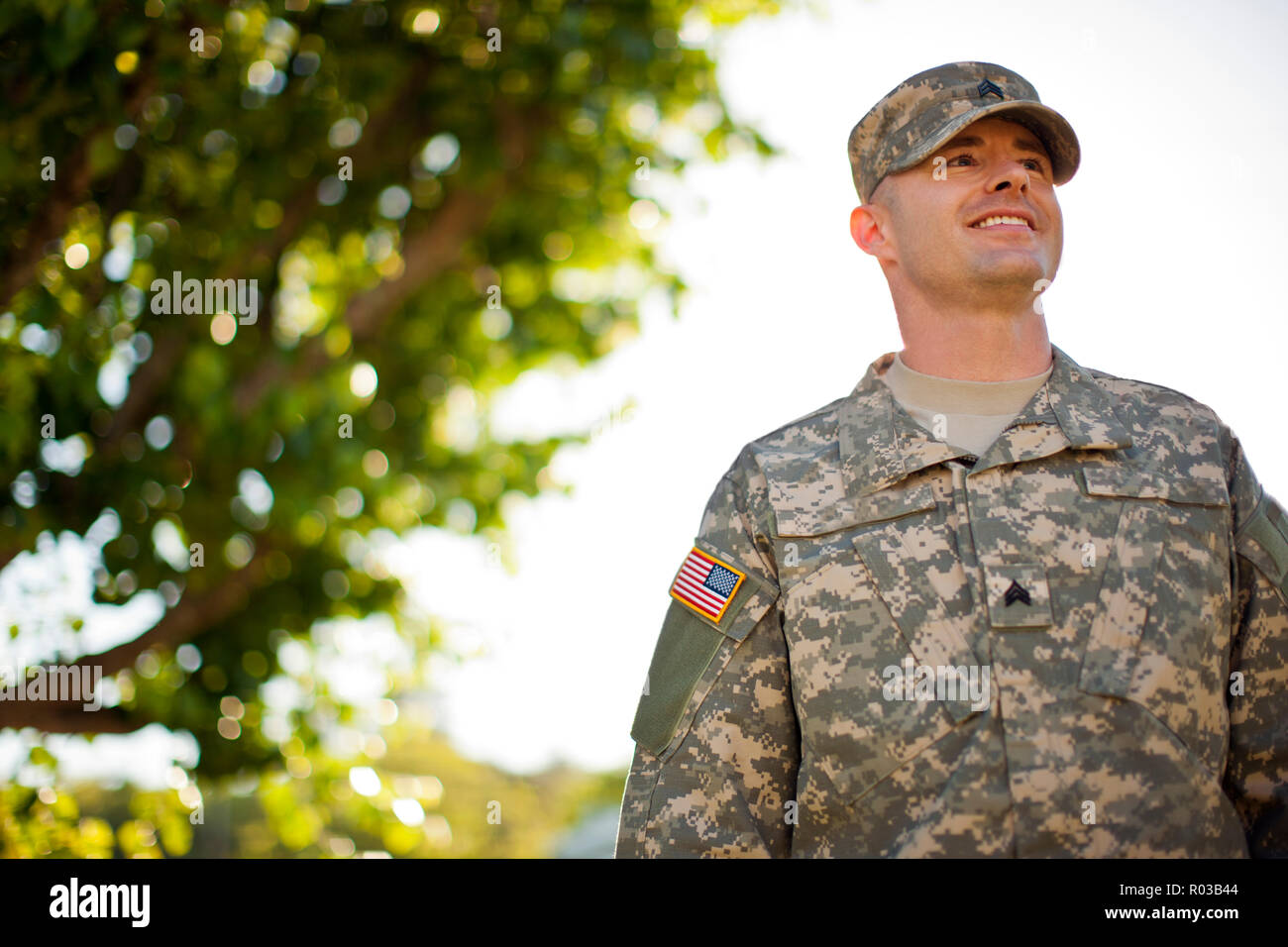 Smiling male army soldier in uniform Stock Photo - Alamy
