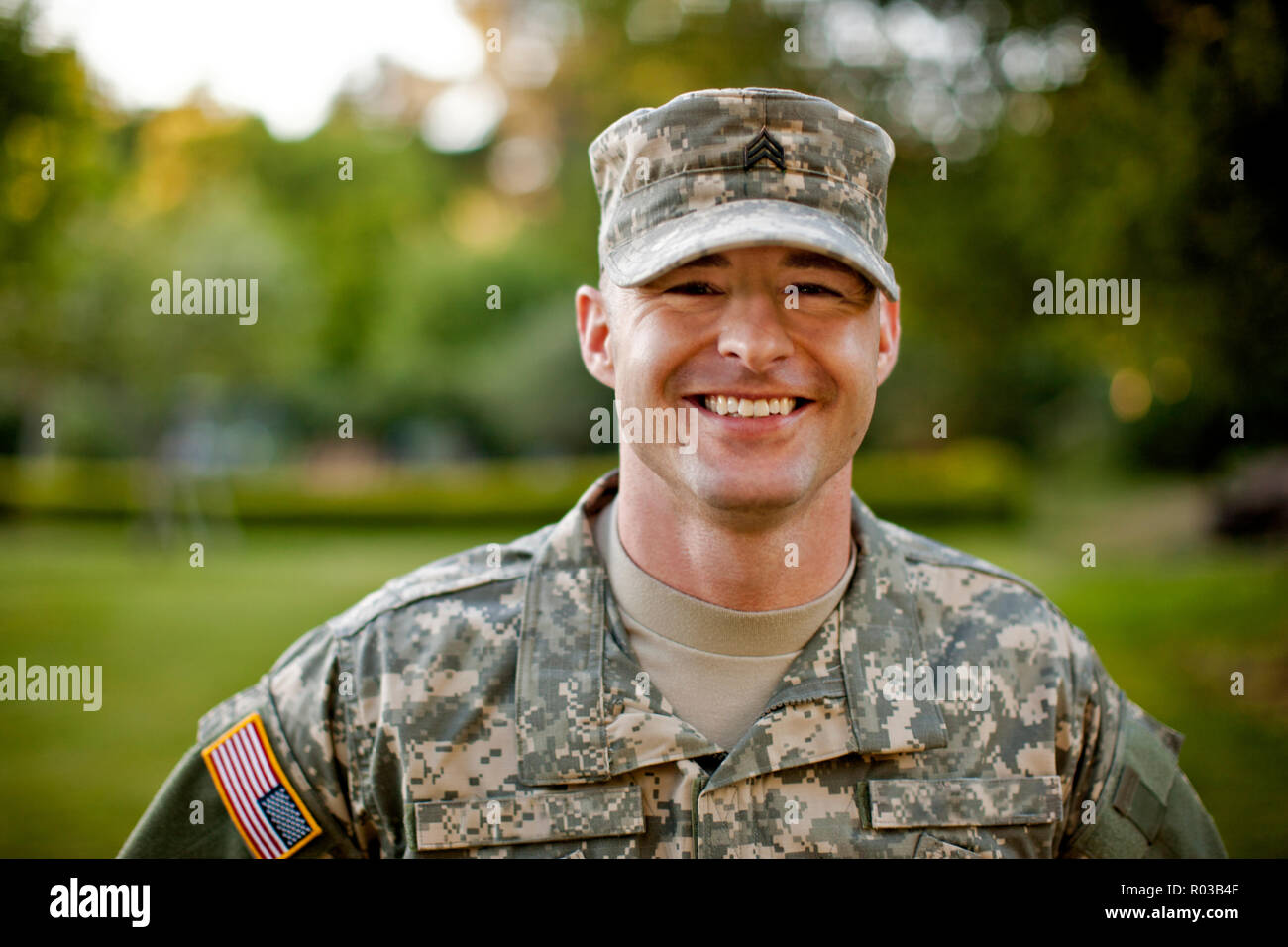 Portrait of a smiling male soldier Stock Photo - Alamy