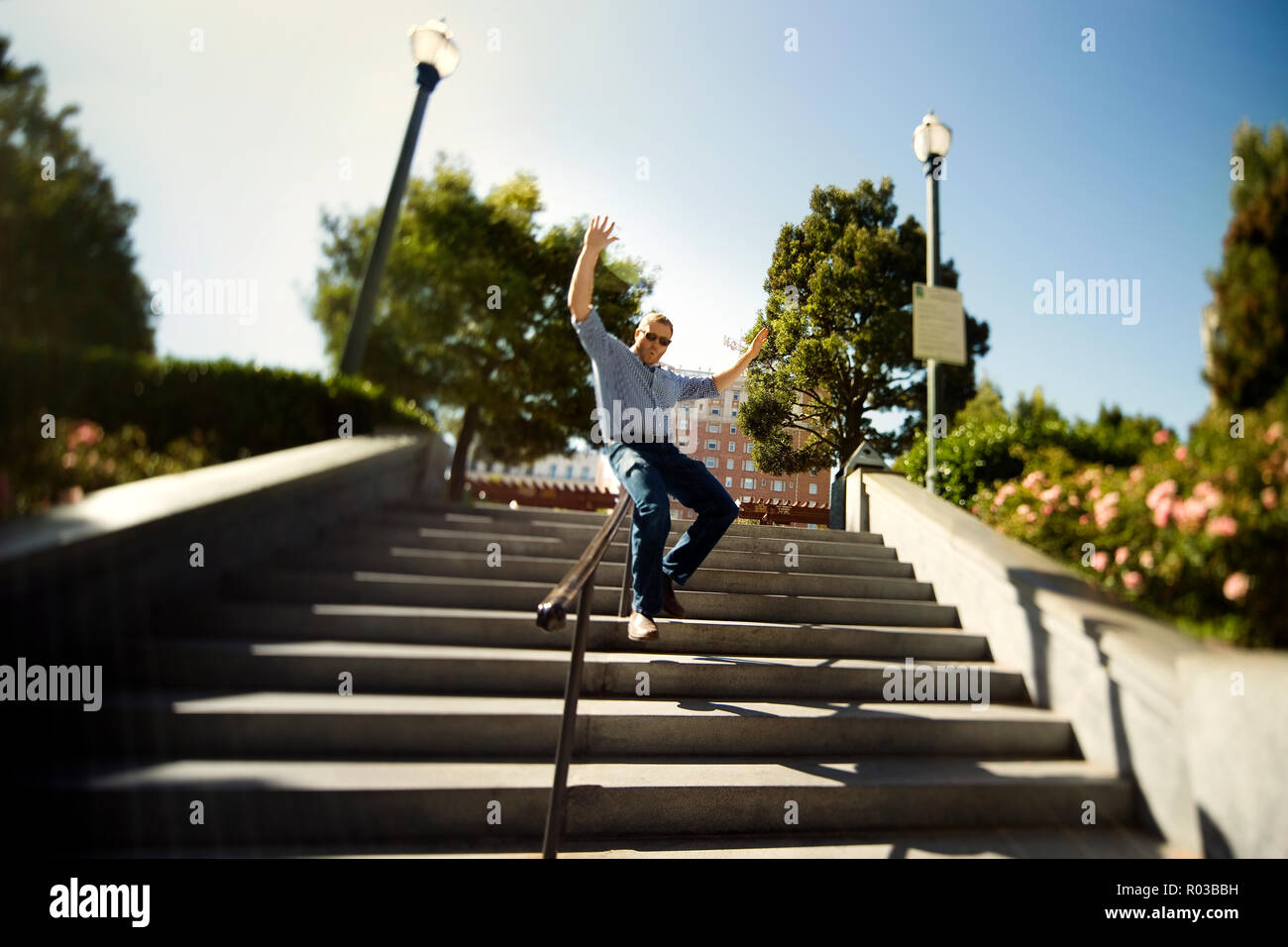 Sliding down stairs hi-res stock photography and images - Alamy