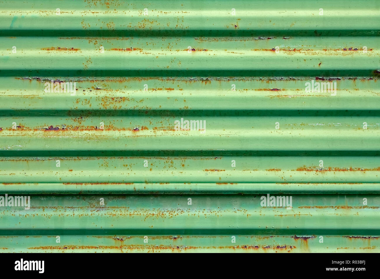 Old rusty metal ribbed surface painted in green color Stock Photo - Alamy