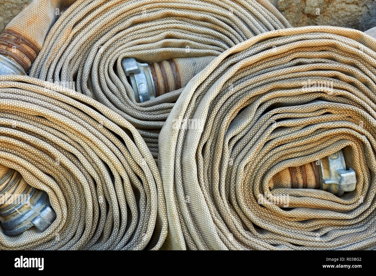 Rolled up fire hose hi-res stock photography and images - Alamy