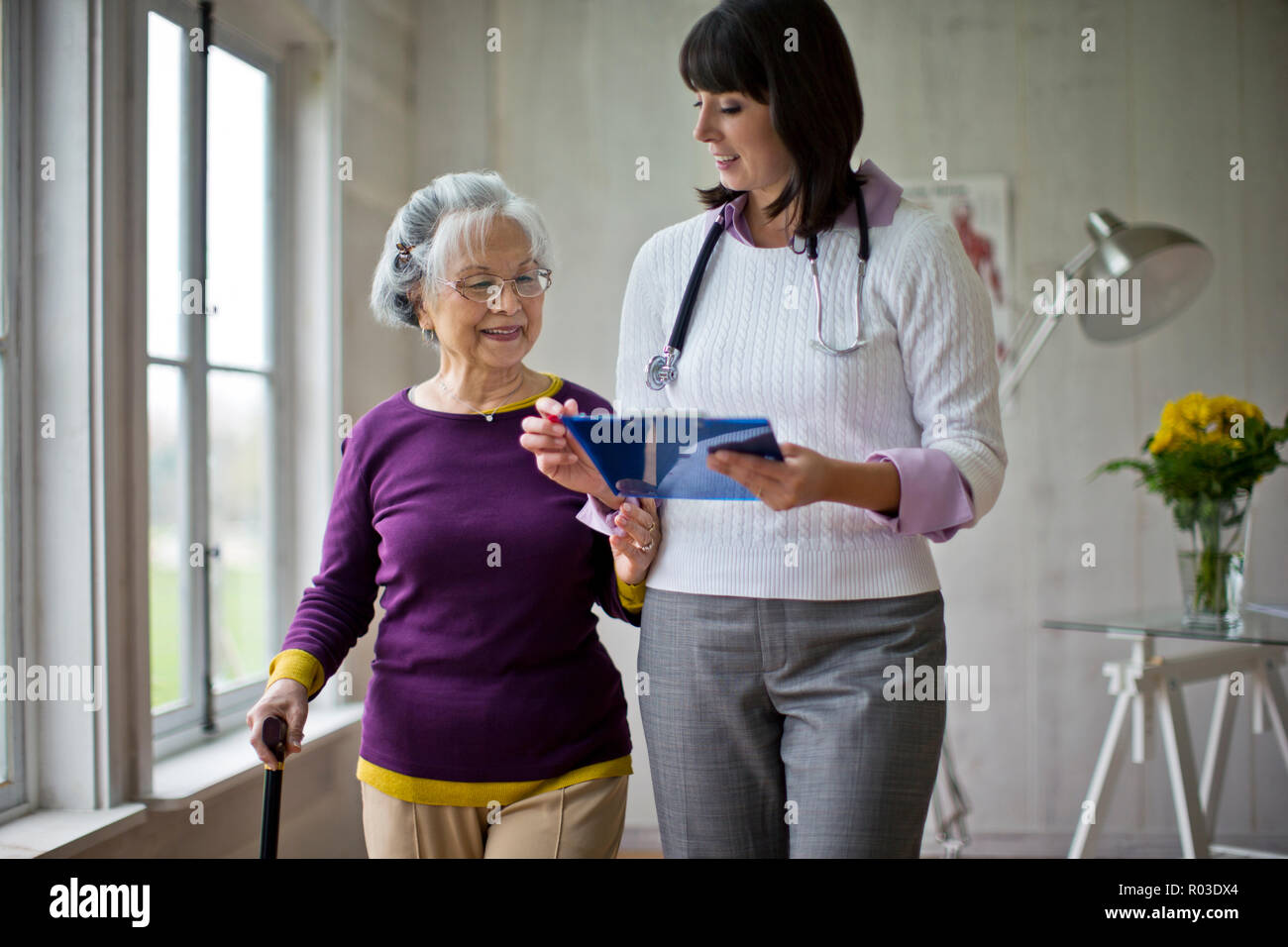 Elderly woman at a medical check-up with her doctor Stock Photo - Alamy