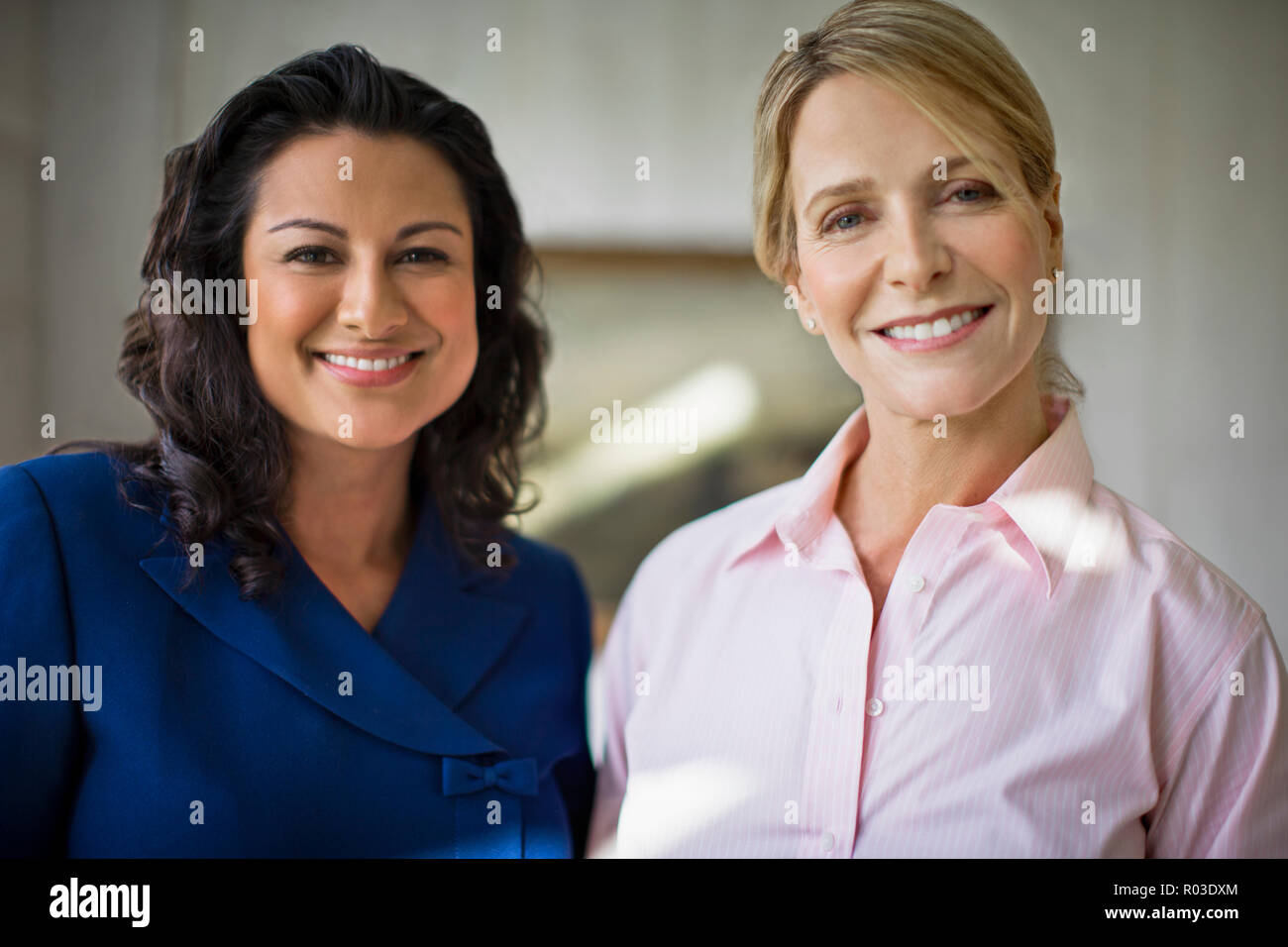 Portrait of two women smiling Stock Photo - Alamy