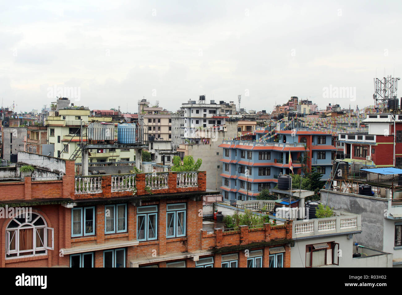 The typical buildings and tenements (including the prayer flags) around ...