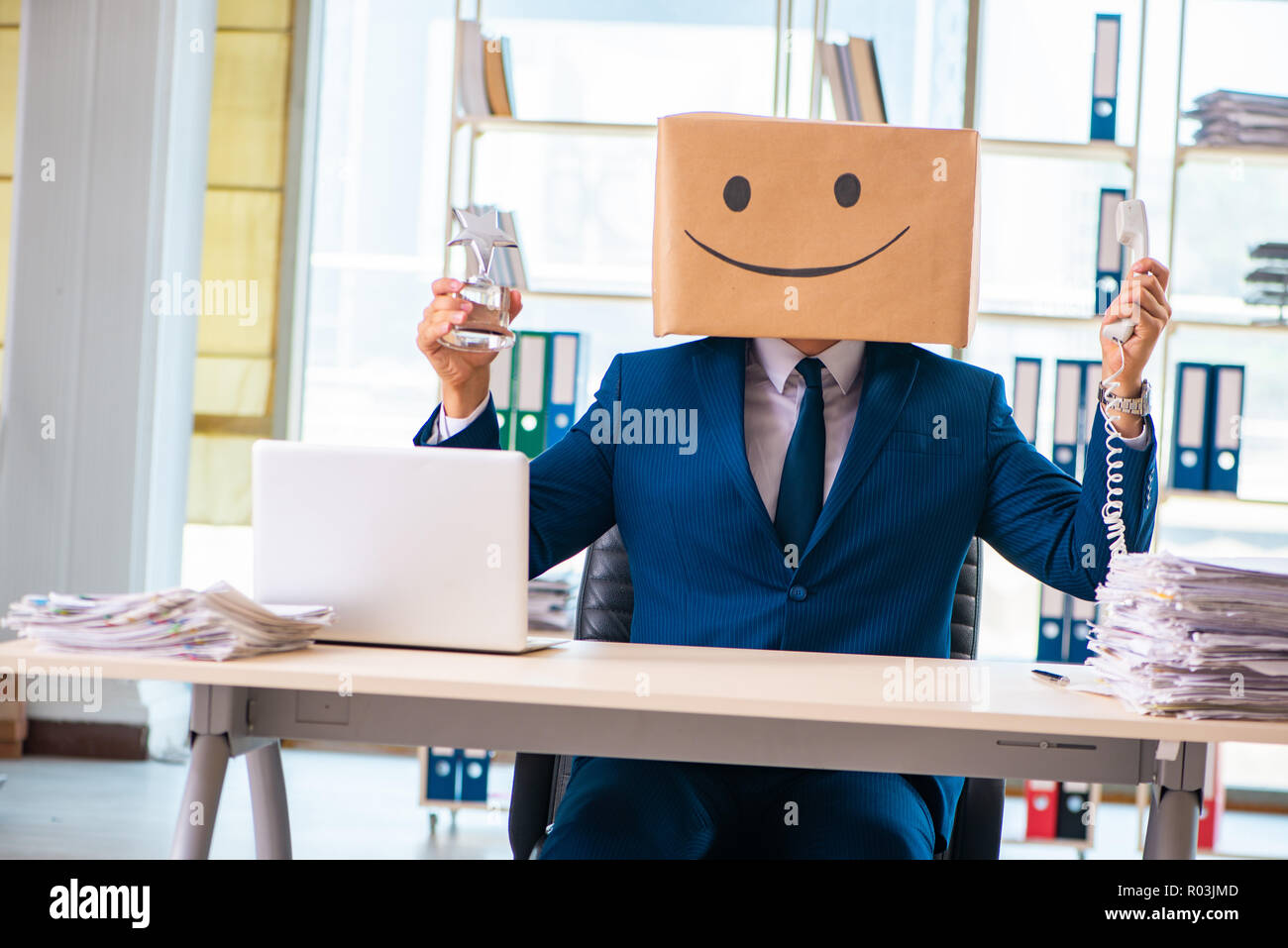 Happy man with box instead of his head Stock Photo - Alamy