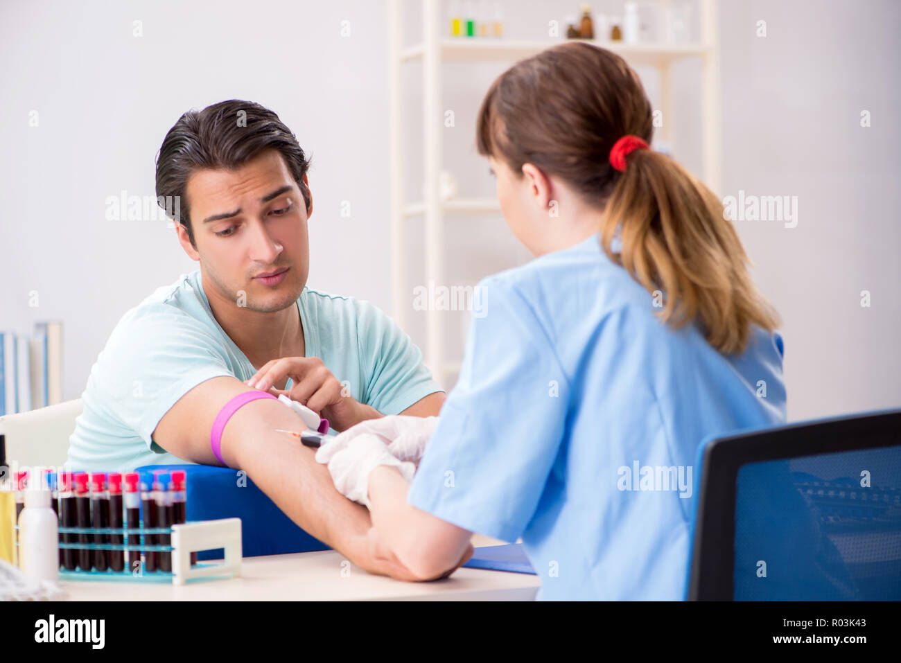 Young patient during blood test sampling procedure Stock Photo - Alamy
