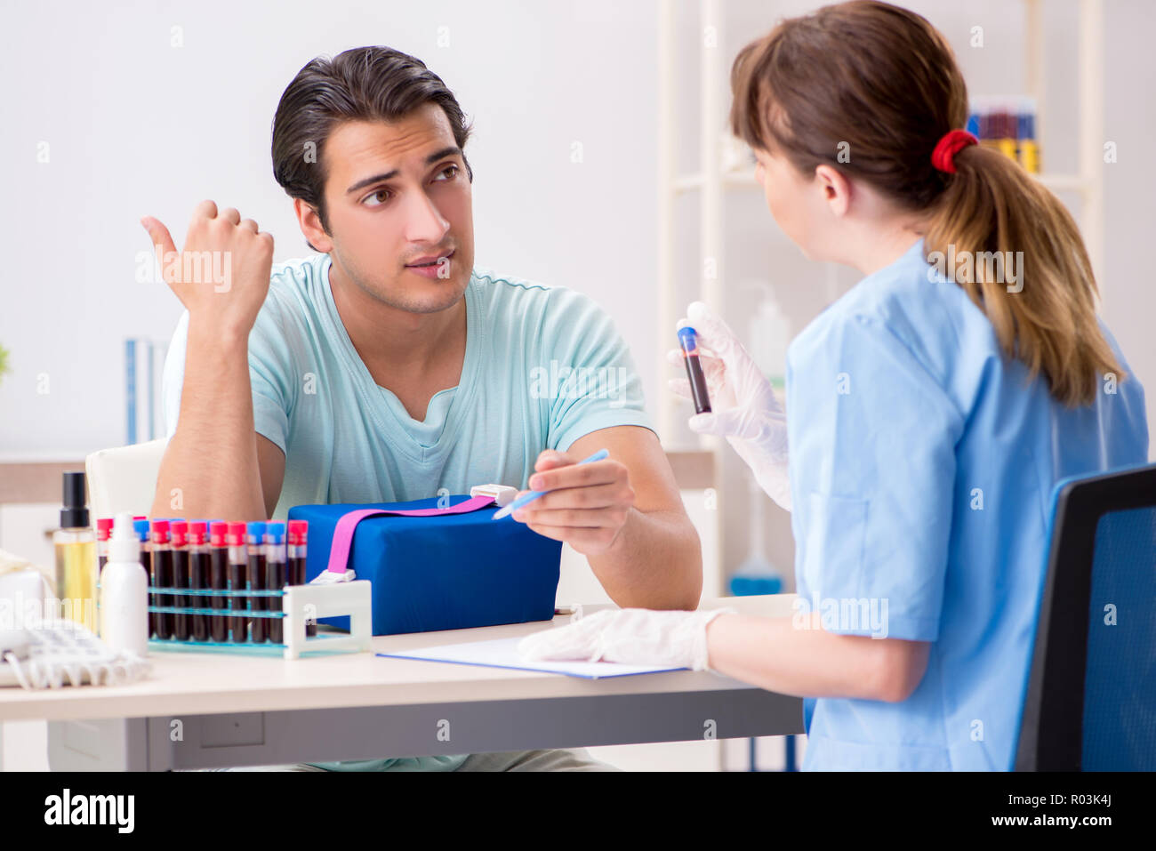 Young patient during blood test sampling procedure Stock Photo - Alamy