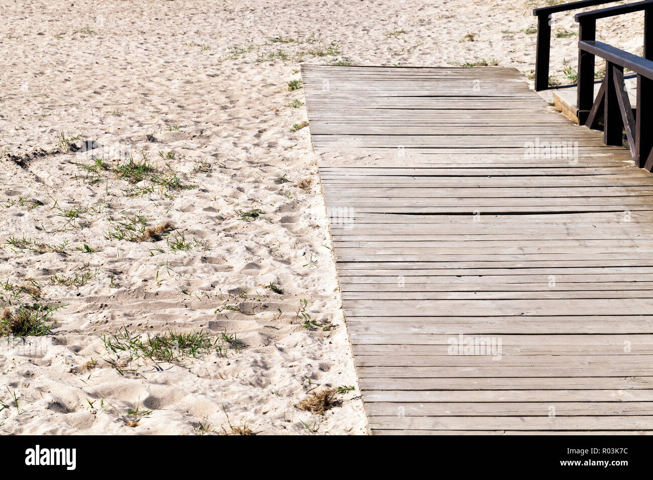 old wooden pier of pine planks, the territory of the sandy beach Stock ...