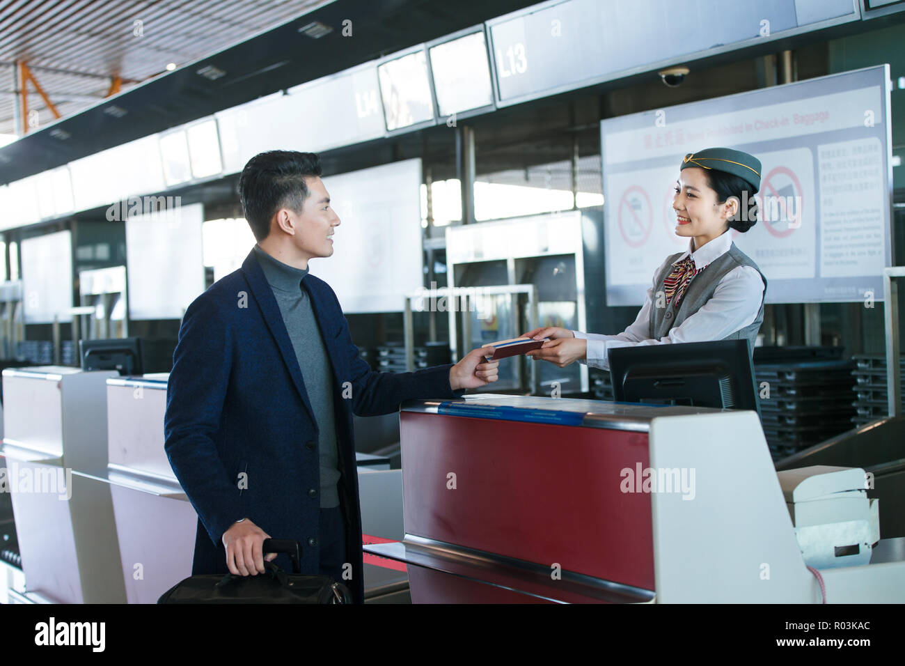 Cabin crew and passengers Stock Photo - Alamy