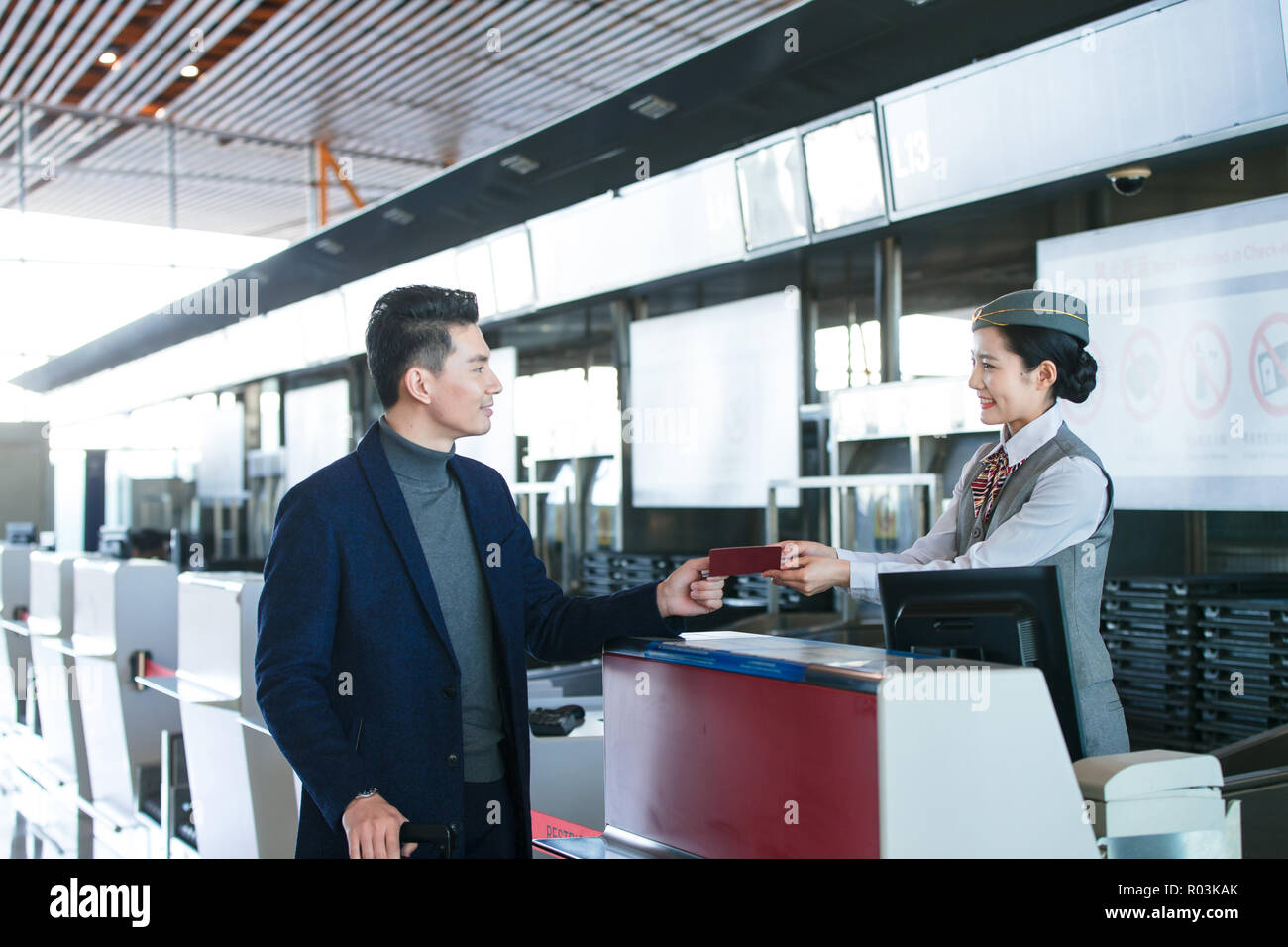 Cabin crew and passengers Stock Photo - Alamy