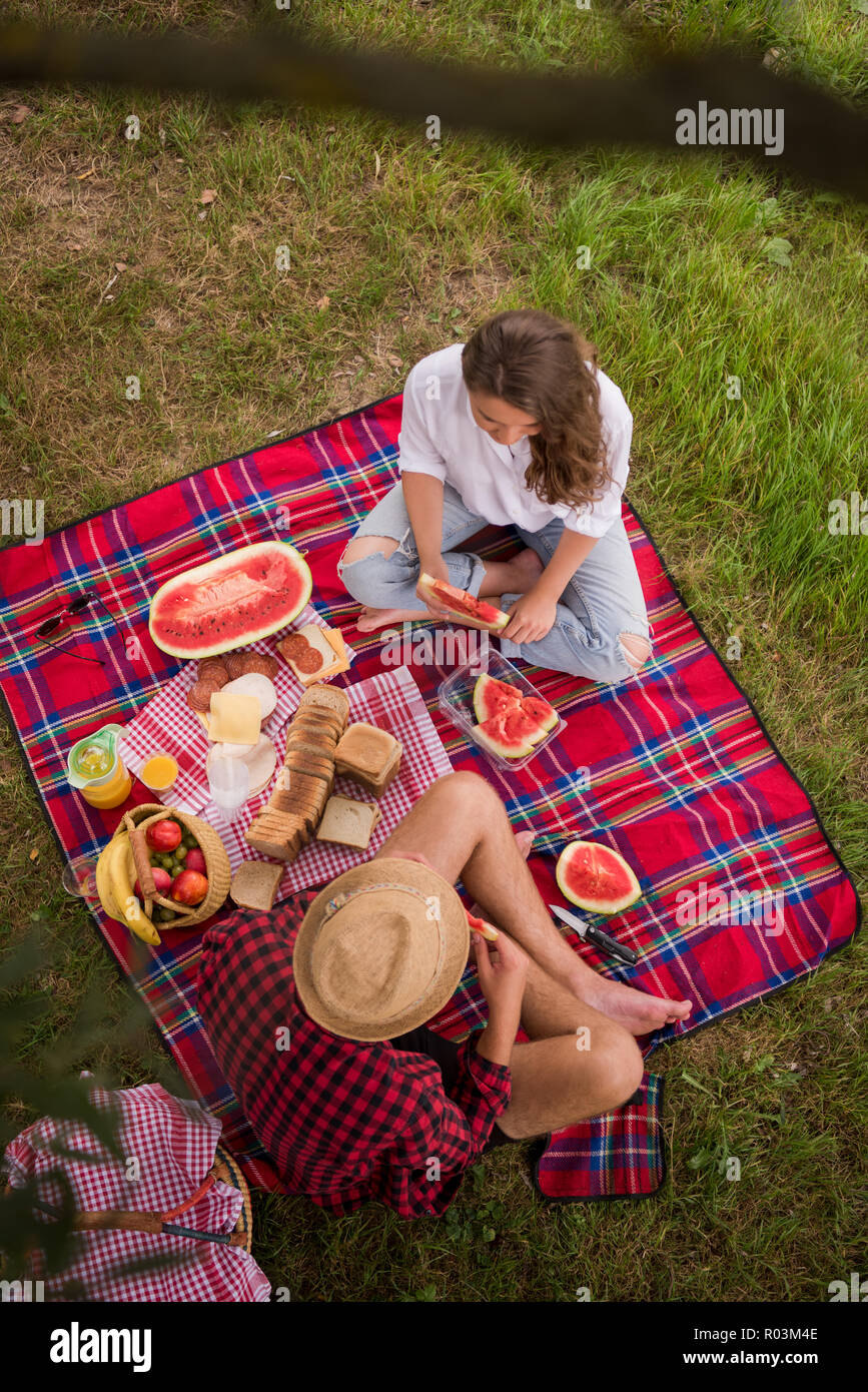 Couple in love enjoying picnic time drink and food in beautiful nature ...