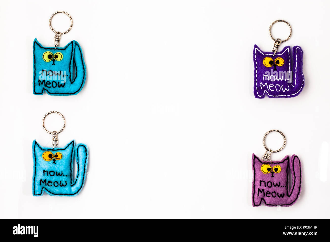 Cats key rings isolated on white background Stock Photo - Alamy
