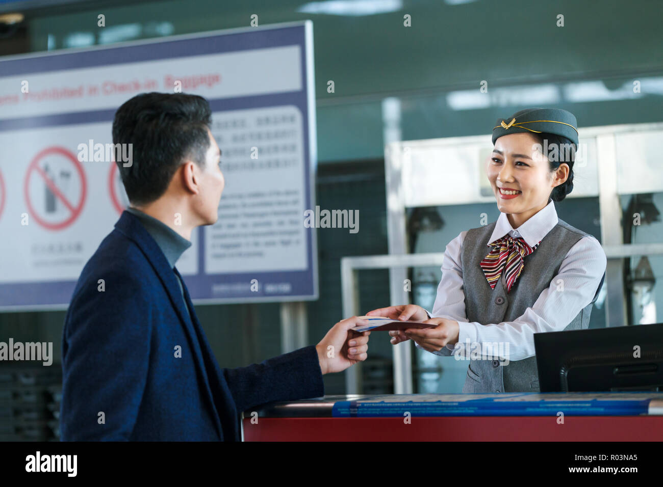 Cabin crew and passengers Stock Photo - Alamy