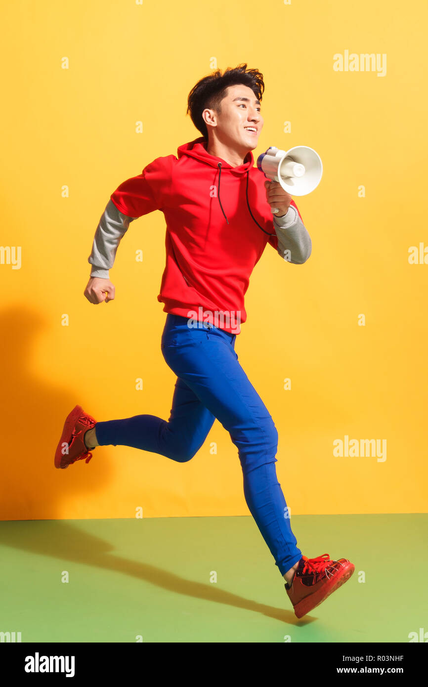 Young man chasing hi-res stock photography and images - Alamy