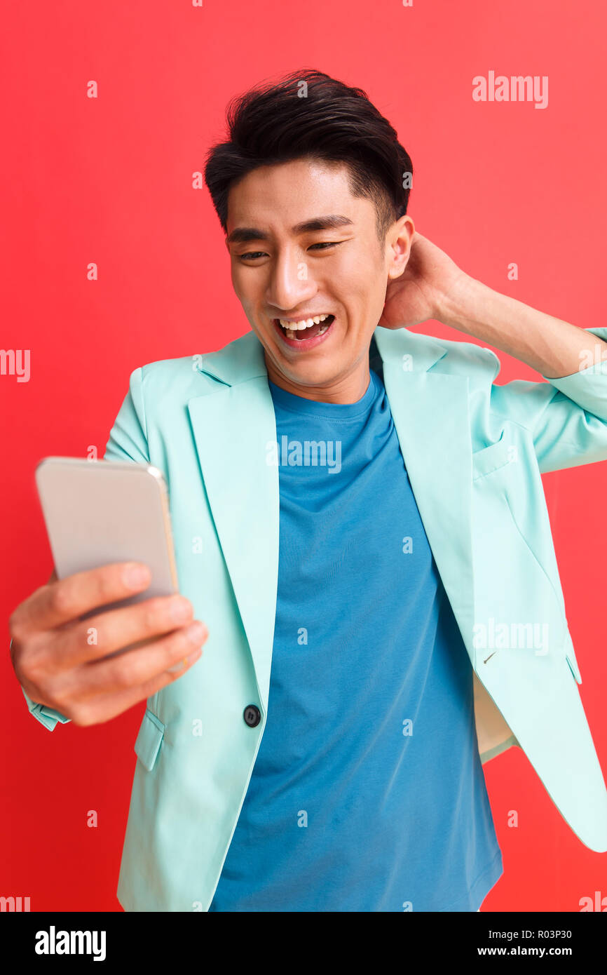 Young men see a mobile phone Stock Photo - Alamy