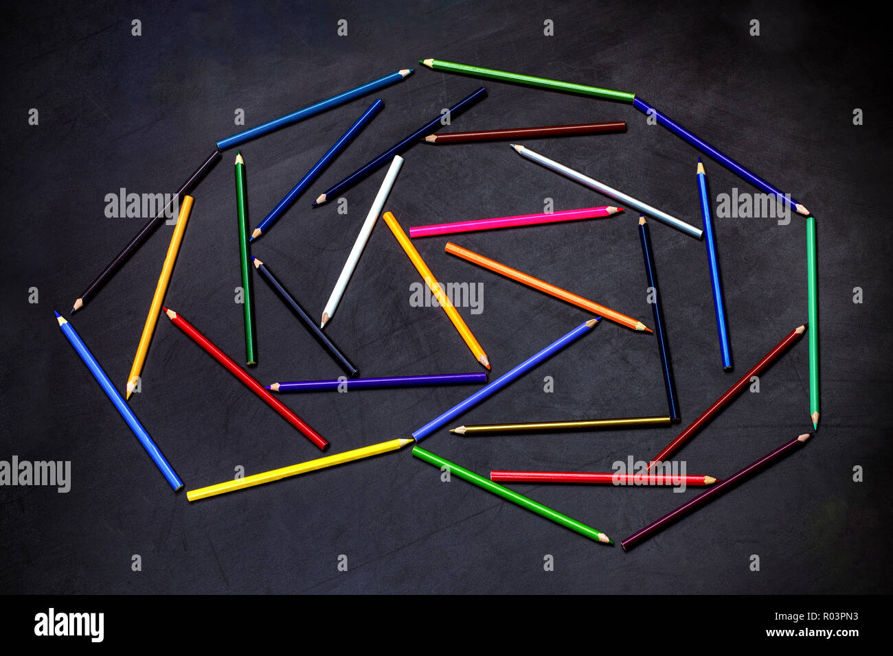 stylized brain from color pencils on a black background Stock Photo - Alamy