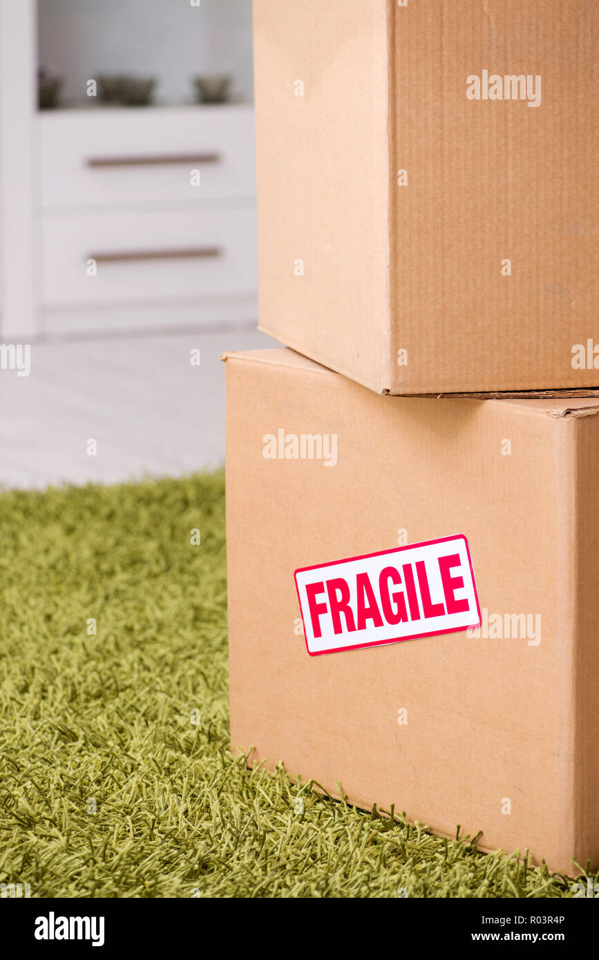 Man moving house and relocating with fragile items Stock Photo - Alamy