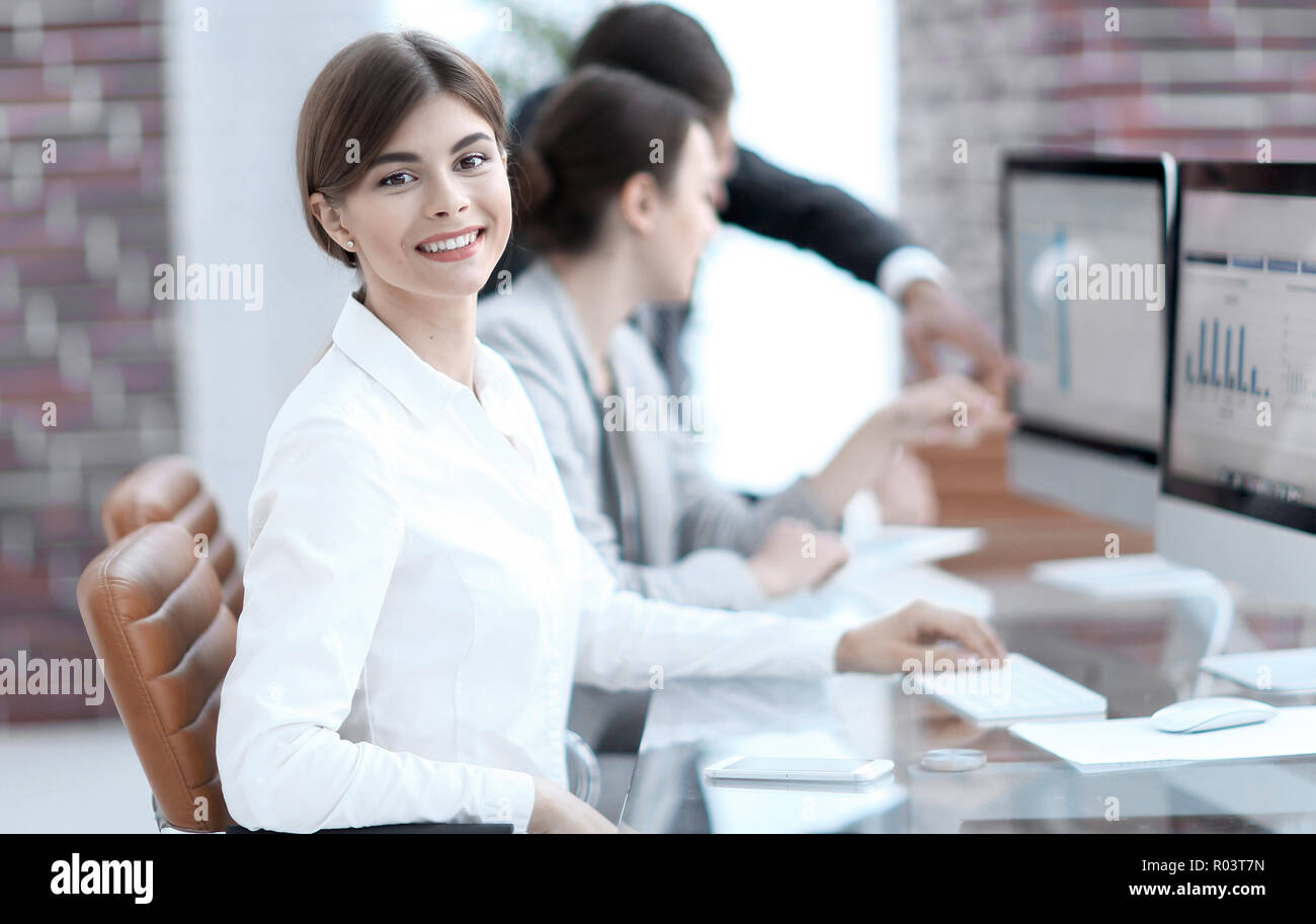 young employee sitting at a Desk Stock Photo - Alamy