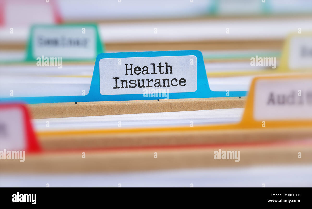 File folders with a tab labeled Health Insurance Stock Photo - Alamy