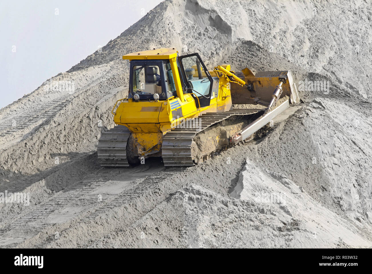 Bulldozer with track move sand at construction site Stock Photo - Alamy