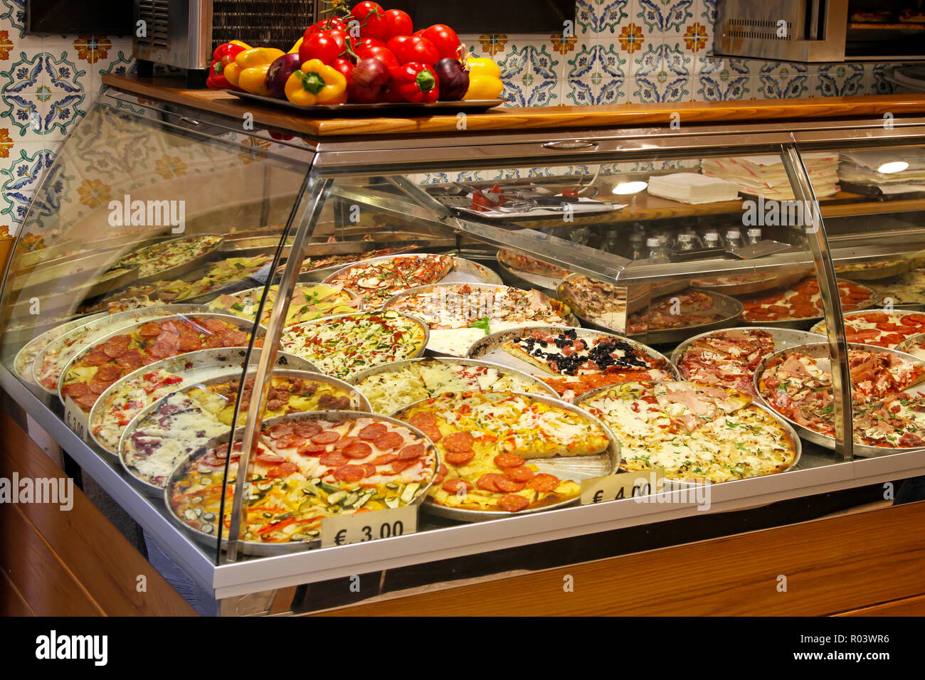 Largest pizza selection in Italian fast food restaurant Stock Photo - Alamy